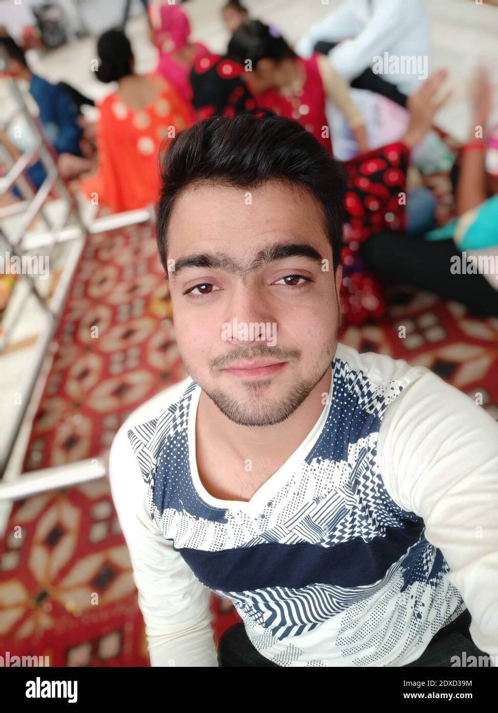 Man sitting on carpet india hi-res stock photography and images - Alamy