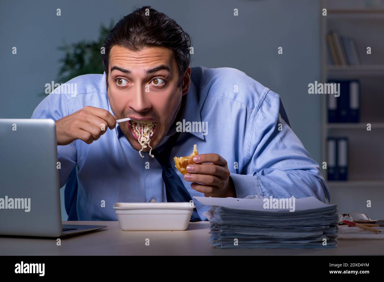 Hungry employee night meal corporate hi-res stock photography and ...