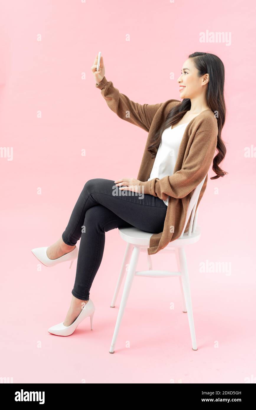 Full length portrait of gorgeous happy woman in business wear taking ...