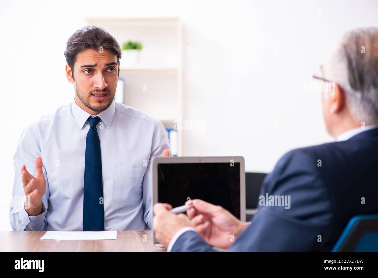 Male candidate employee meeting with old recruiter Stock Photo - Alamy