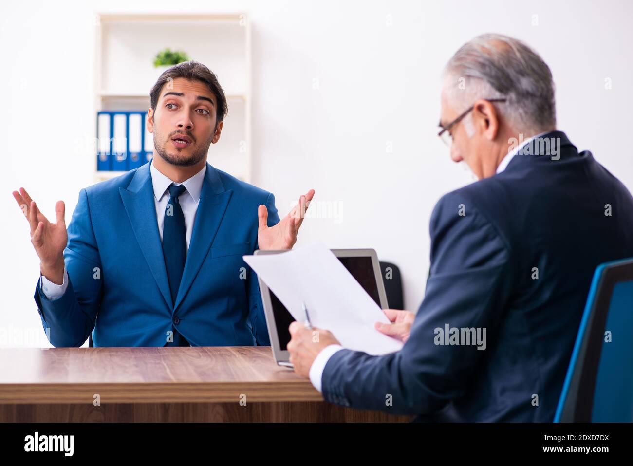 Male candidate employee meeting with old recruiter Stock Photo - Alamy