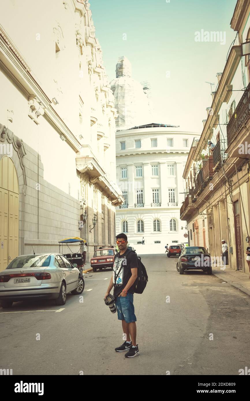 photographer in Havana, Cuba alley and Capitolio Stock Photo - Alamy