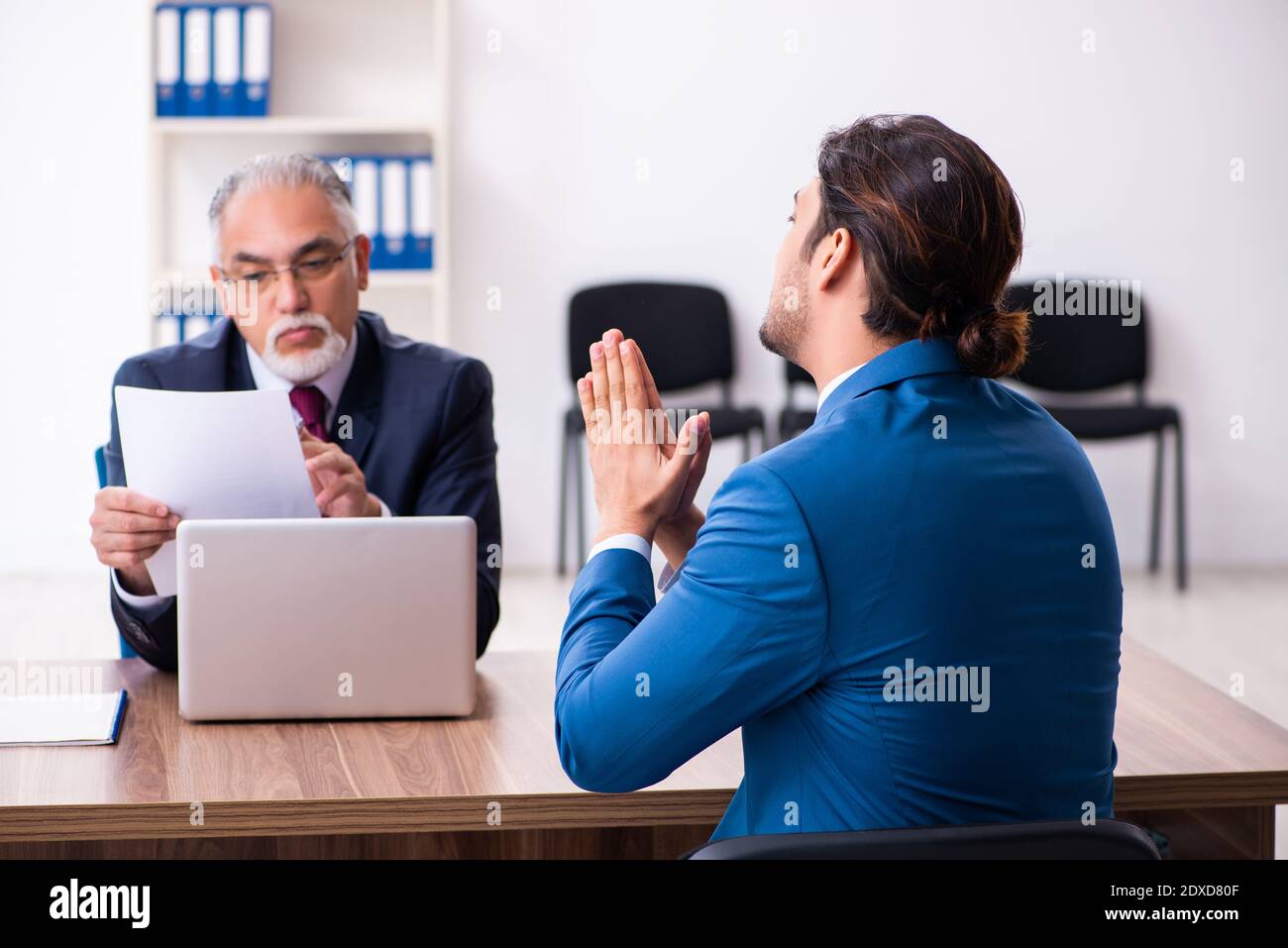 Male candidate employee meeting with old recruiter Stock Photo - Alamy