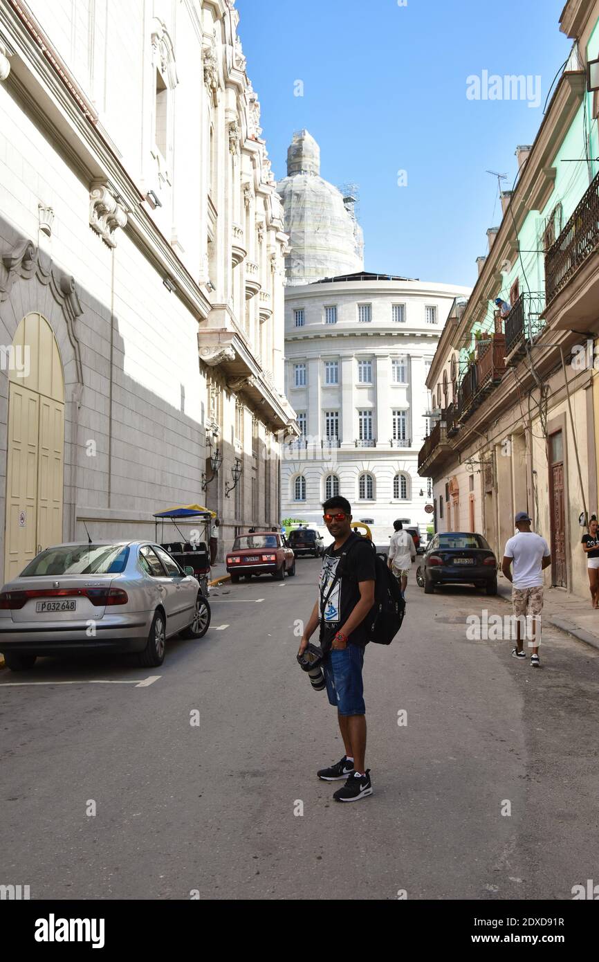 photographer in Havana, Cuba alley and Capitolio Stock Photo - Alamy