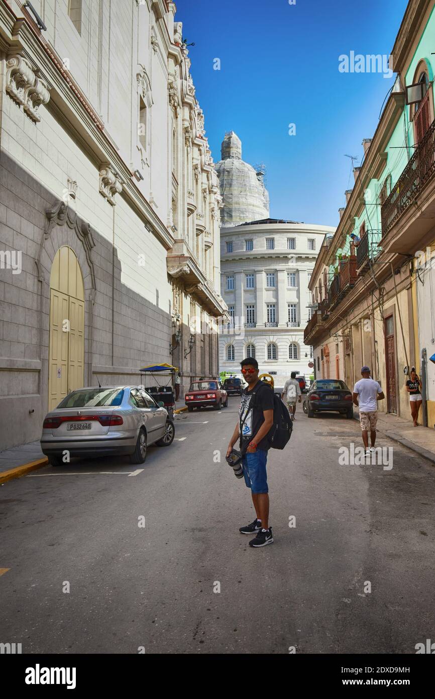 photographer in Havana, Cuba alley and Capitolio Stock Photo - Alamy