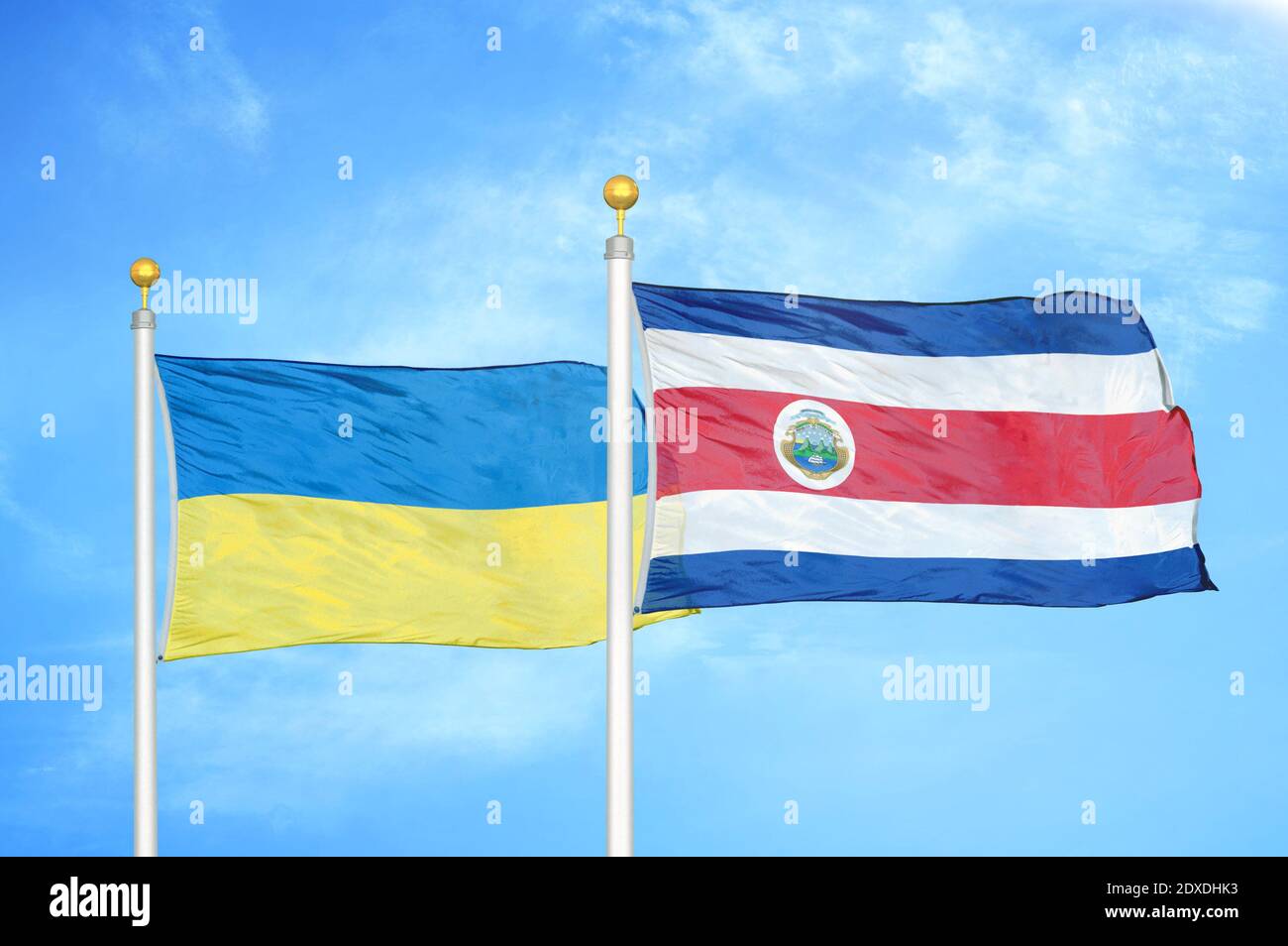 Ukraine and Costa Rica two flags on flagpoles and blue sky Stock Photo ...