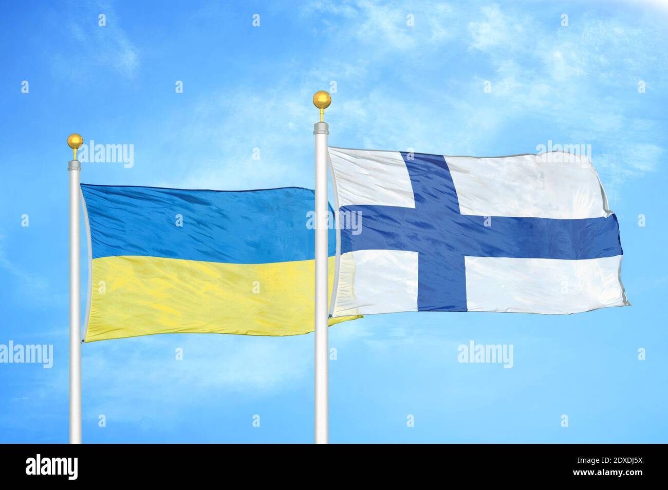 Ukraine and Finland two flags on flagpoles and blue sky Stock Photo - Alamy