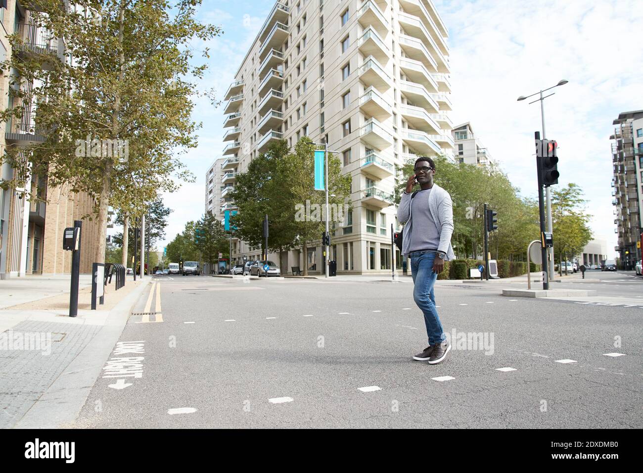 Using mobile phone crossing cell phone hi-res stock photography and ...