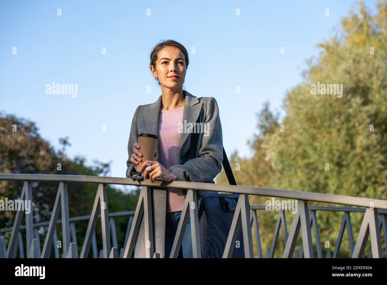 Leaning over railing hi-res stock photography and images - Alamy
