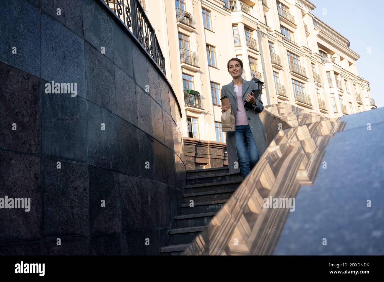 Staircase looking down female hi-res stock photography and images - Alamy