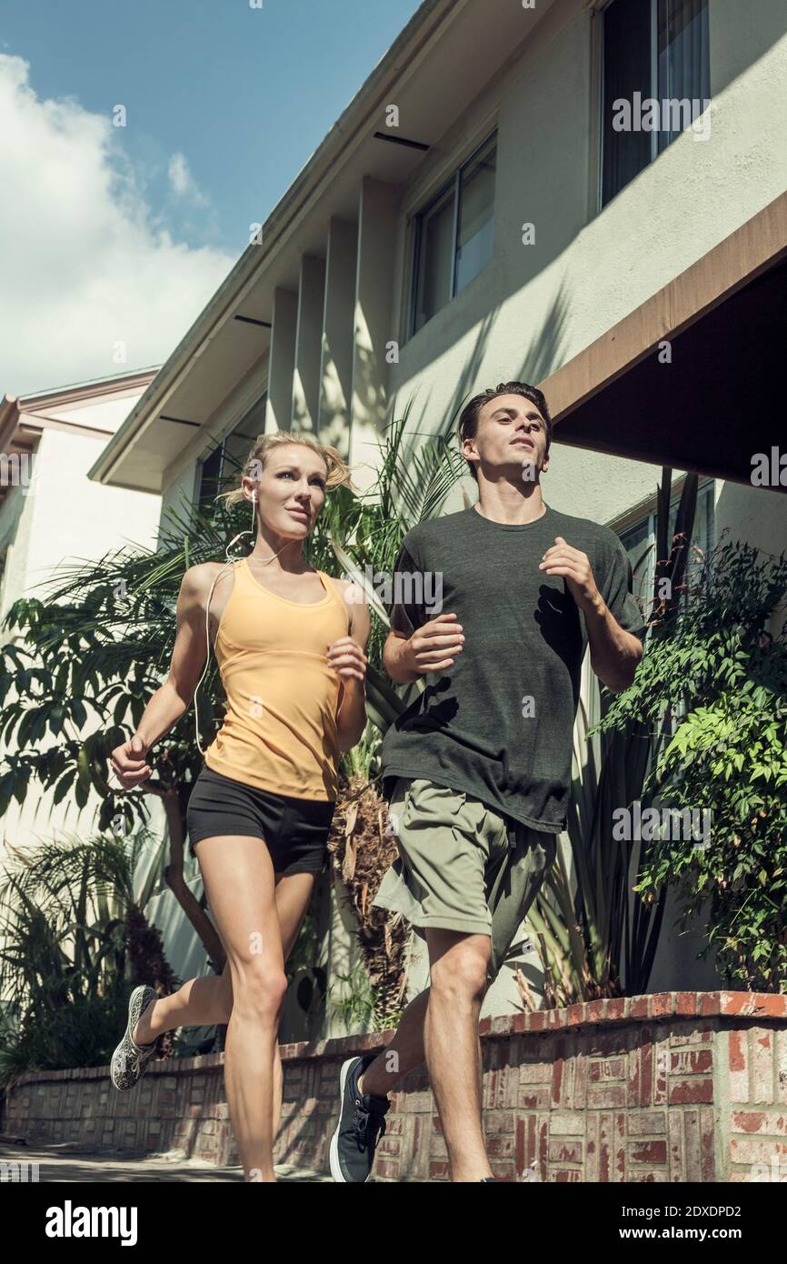 Running man woman couple hi-res stock photography and images - Alamy