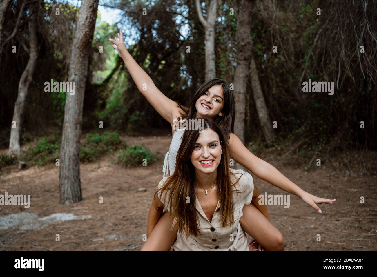 Girl getting piggyback ride hi-res stock photography and images - Alamy