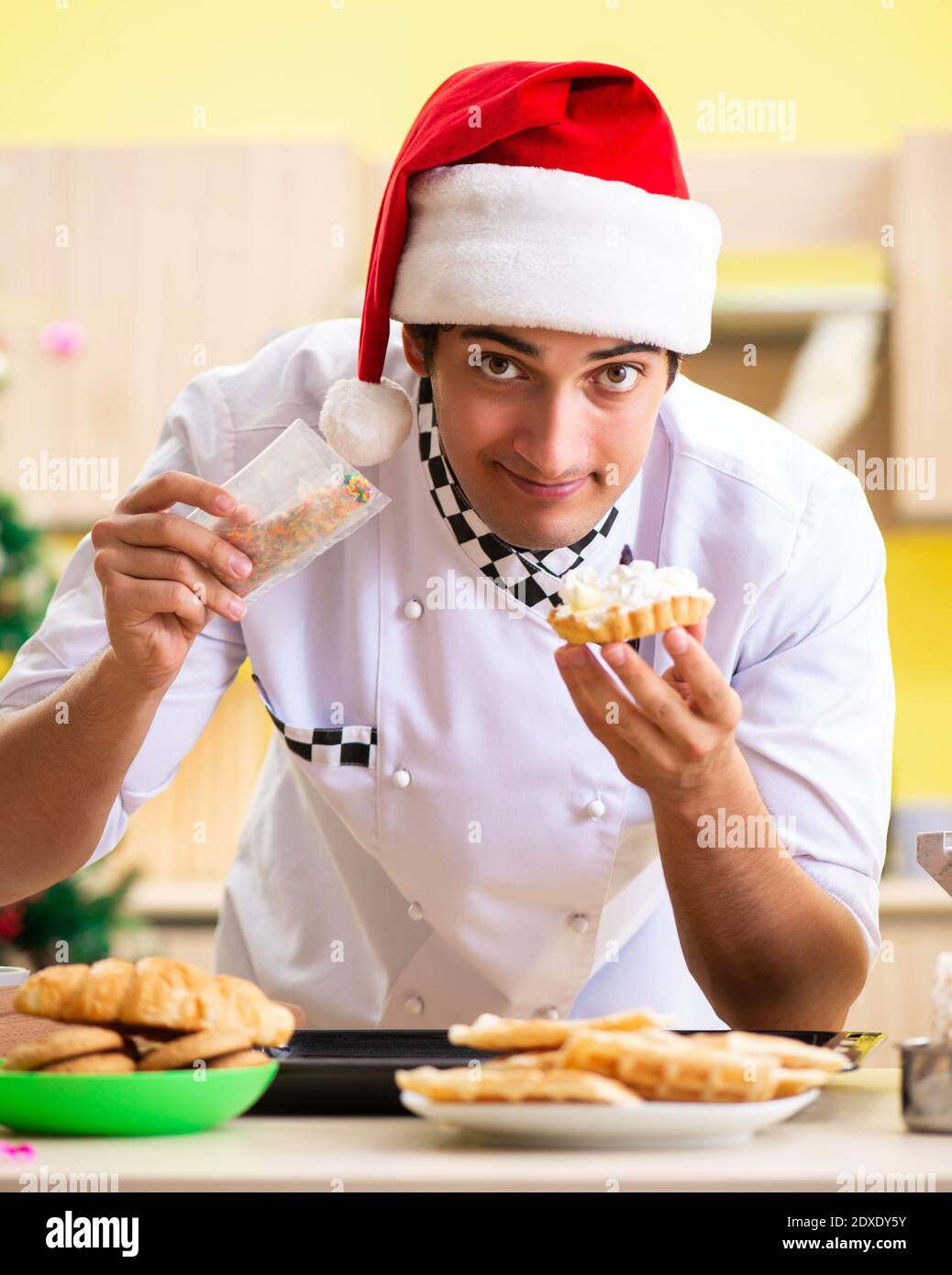 The young chef husband working in kitchen at christmas eve Stock Photo ...