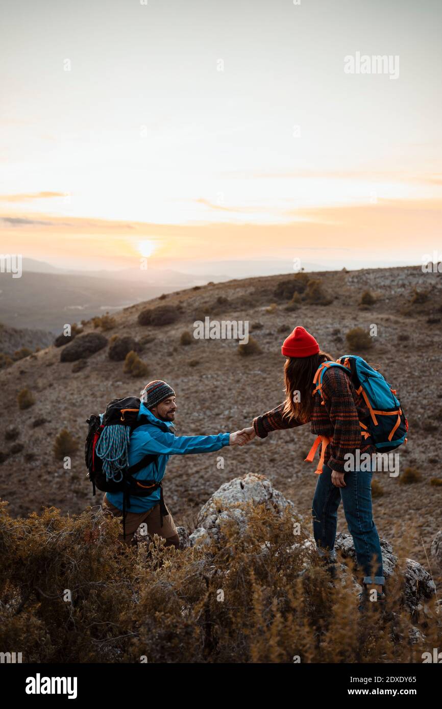 Helping hand mountain climbing hi-res stock photography and images - Alamy
