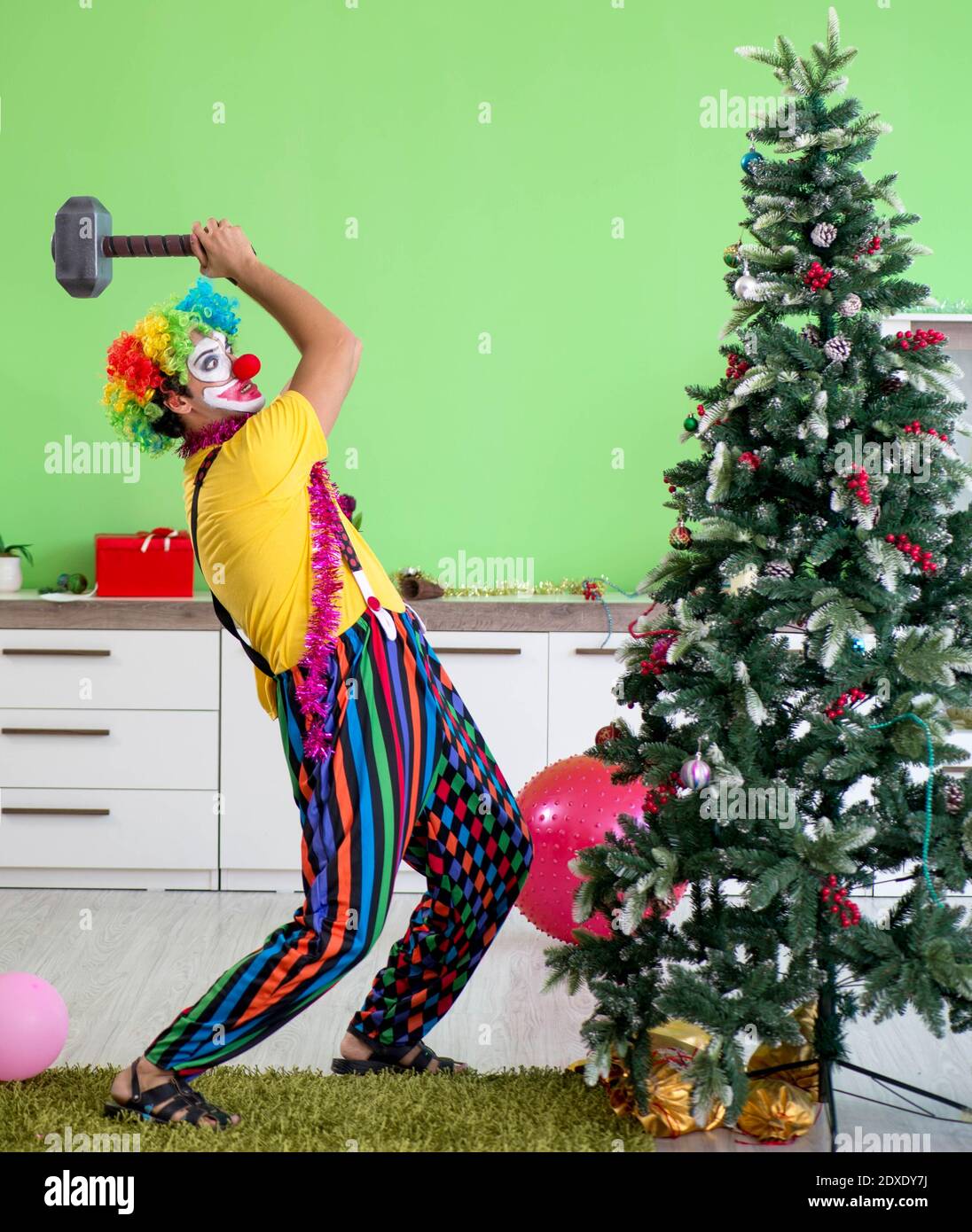 The funny clown in christmas celebration concept Stock Photo - Alamy