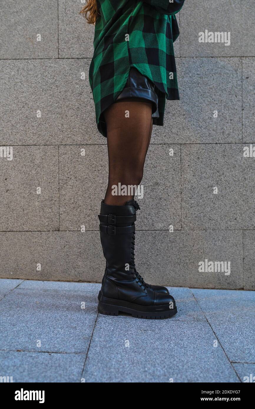 Woman wearing boots hi-res stock photography and images - Alamy