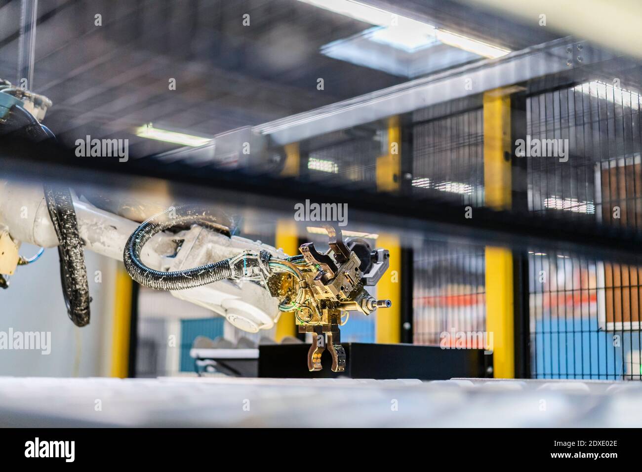 Robotic arm over production line in industry Stock Photo - Alamy