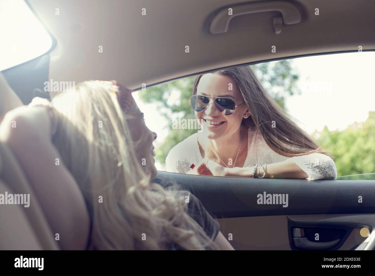 Talking through car window hi-res stock photography and images - Alamy