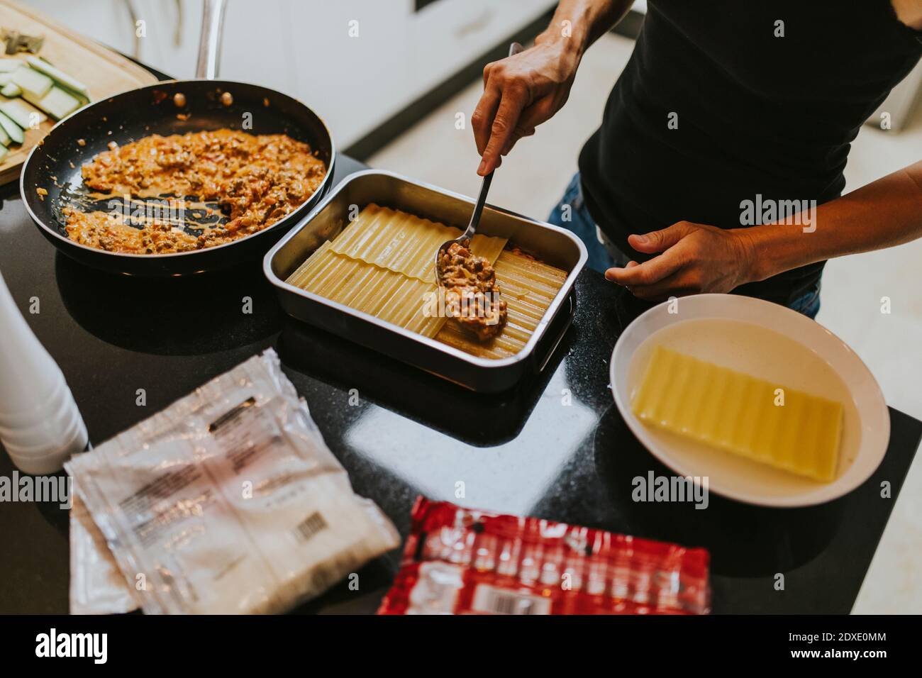 Woman making lasagna on kitchen hi-res stock photography and images - Alamy