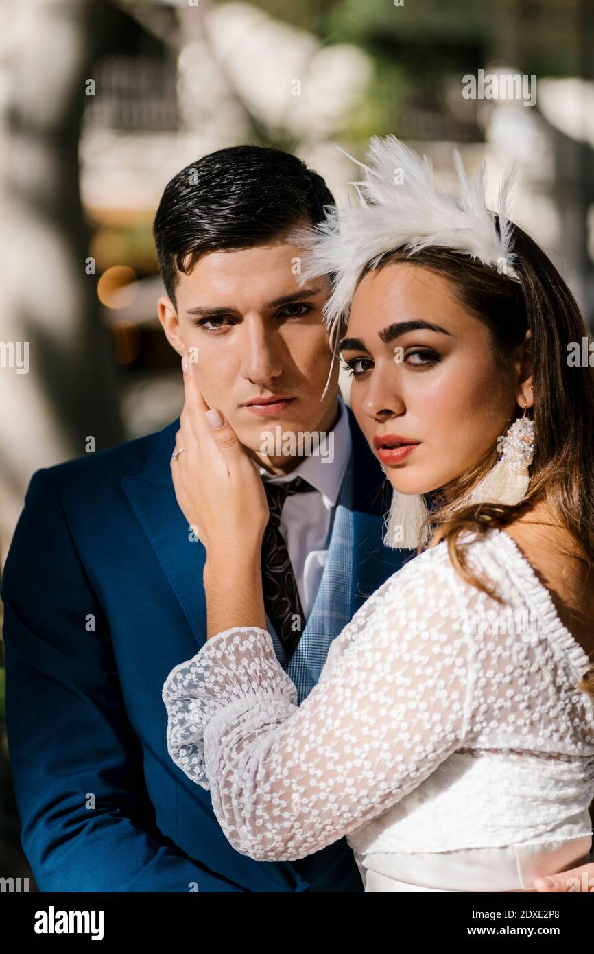 Elegant couple embracing each other on sunny day Stock Photo - Alamy