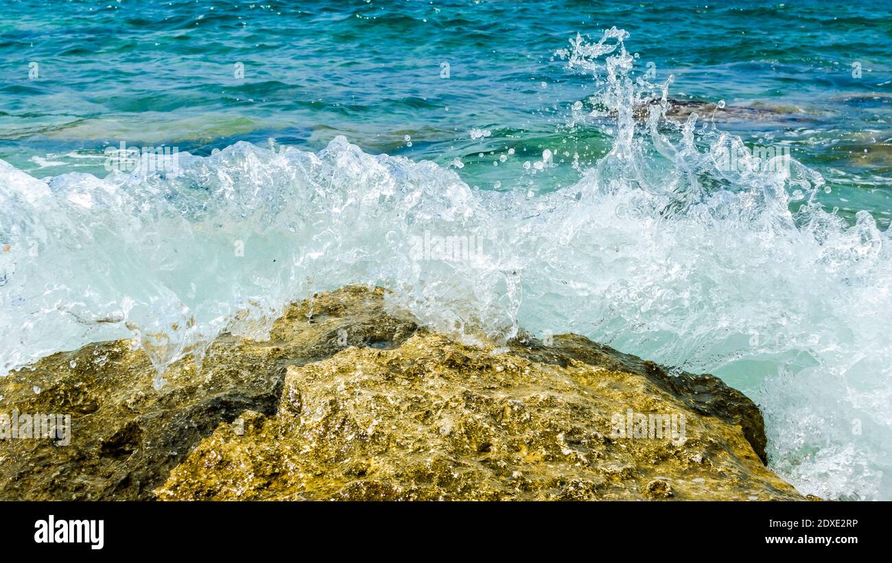 Surf on the rock at Corfu, Greece Stock Photo - Alamy