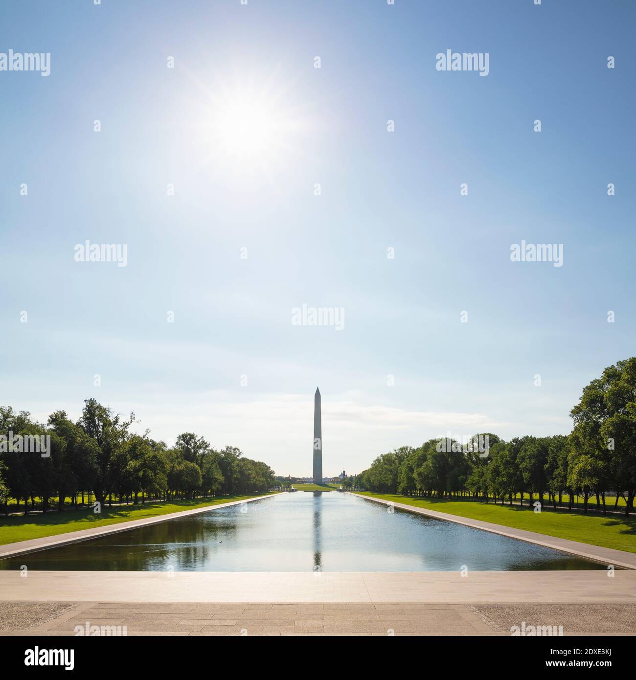 USA, Washington DC, Sun shining over Lincoln Memorial Reflecting Pool ...