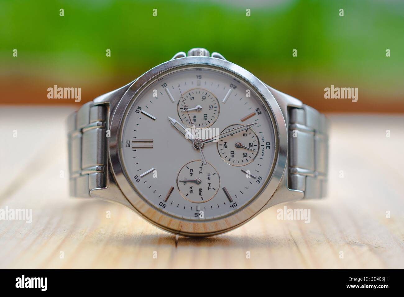 Hand Watch clock time on wood table Stock Photo - Alamy