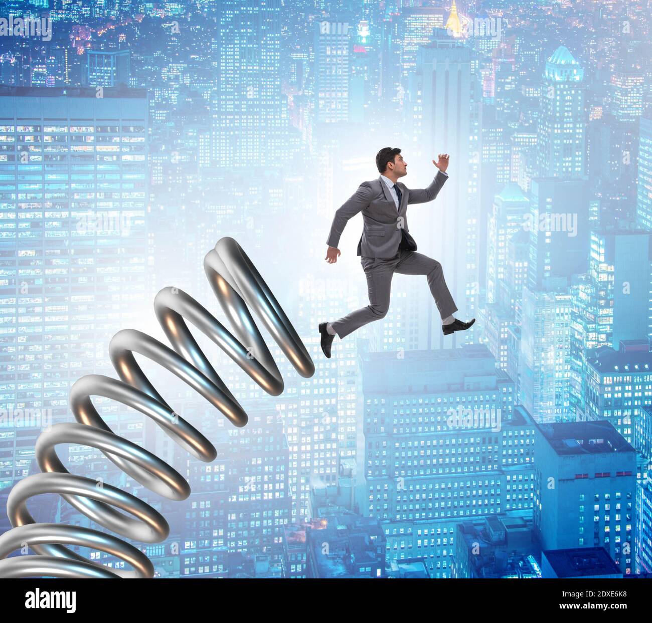 The businessman jumping from spring in promotion concept Stock Photo ...