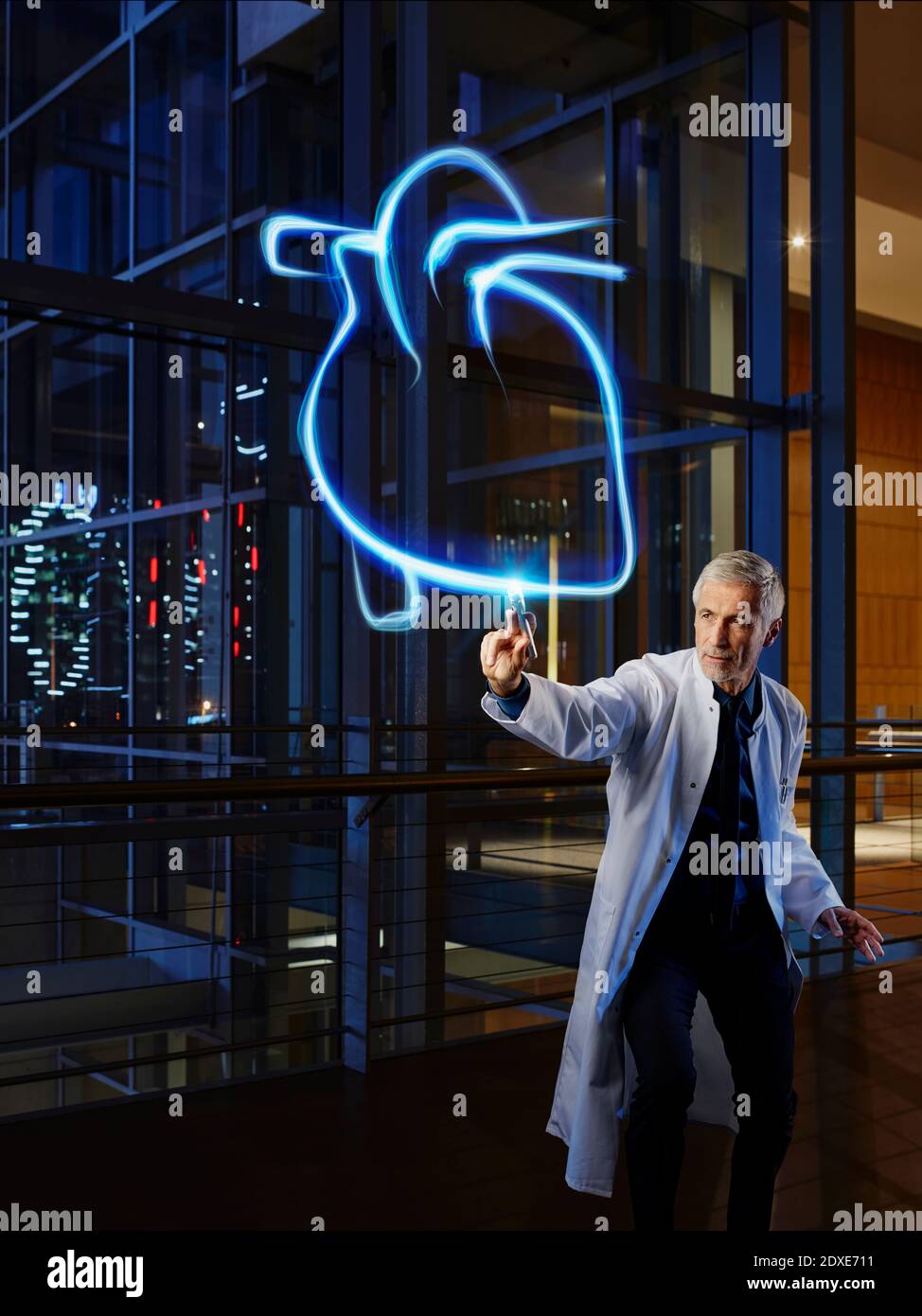 Male cardiologist examining heart in laboratory at hospital Stock Photo ...