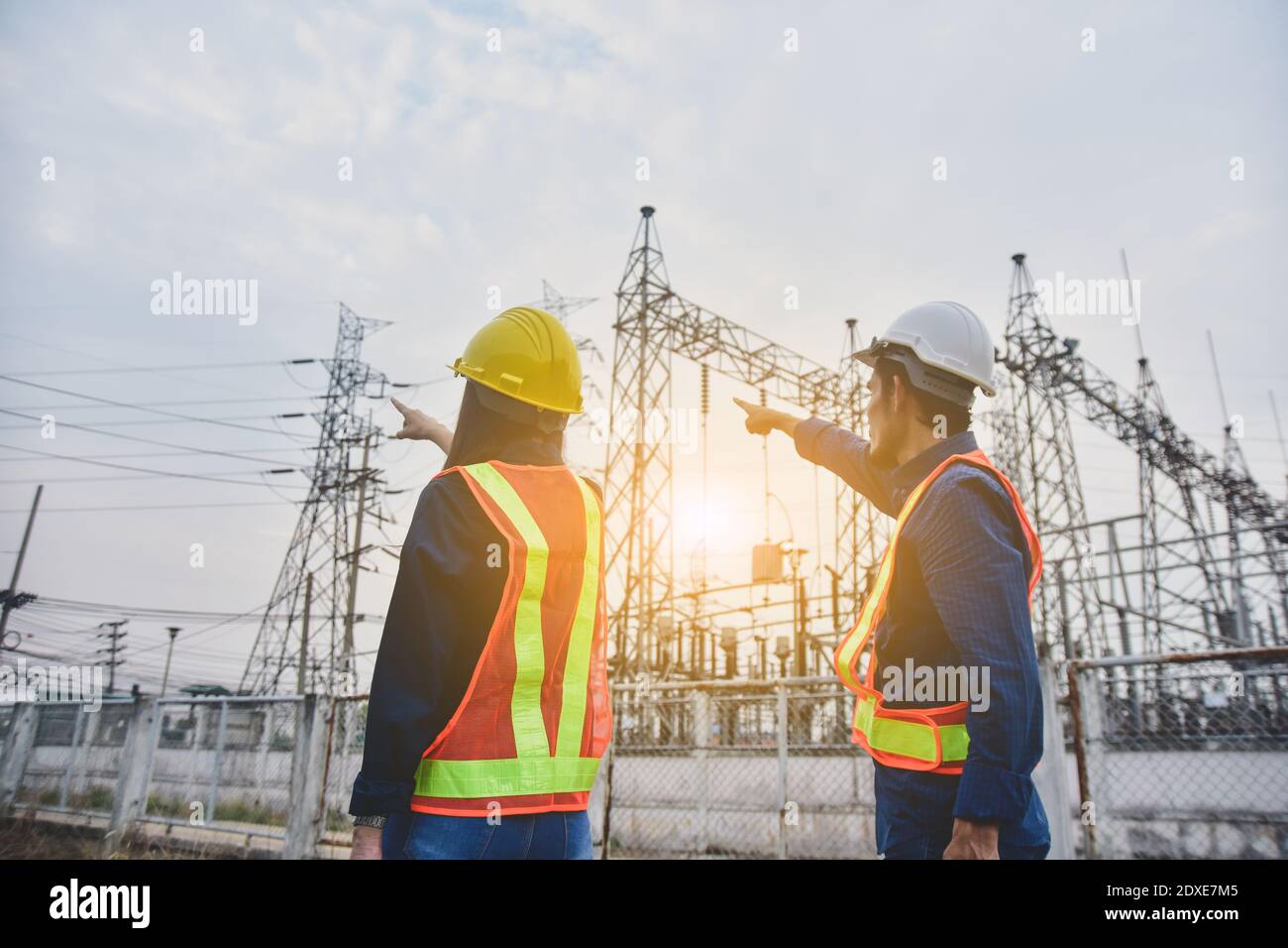 Man and Women Engineering standing communication at power plant ... Man and Women Engineering standing communication at power plant ...