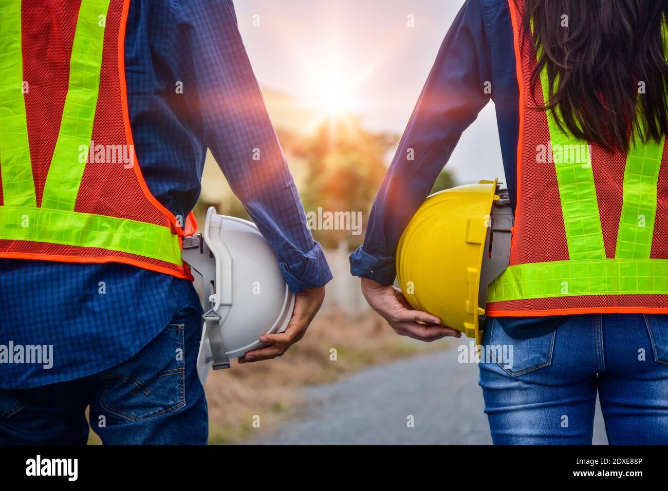 Man and Women Engineer holding hardhat safety Standing outdoor Teamwork ...