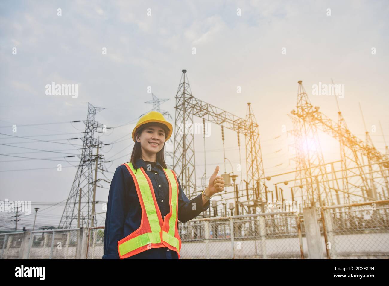 Women Engineering standing communication at power plant electrical ...