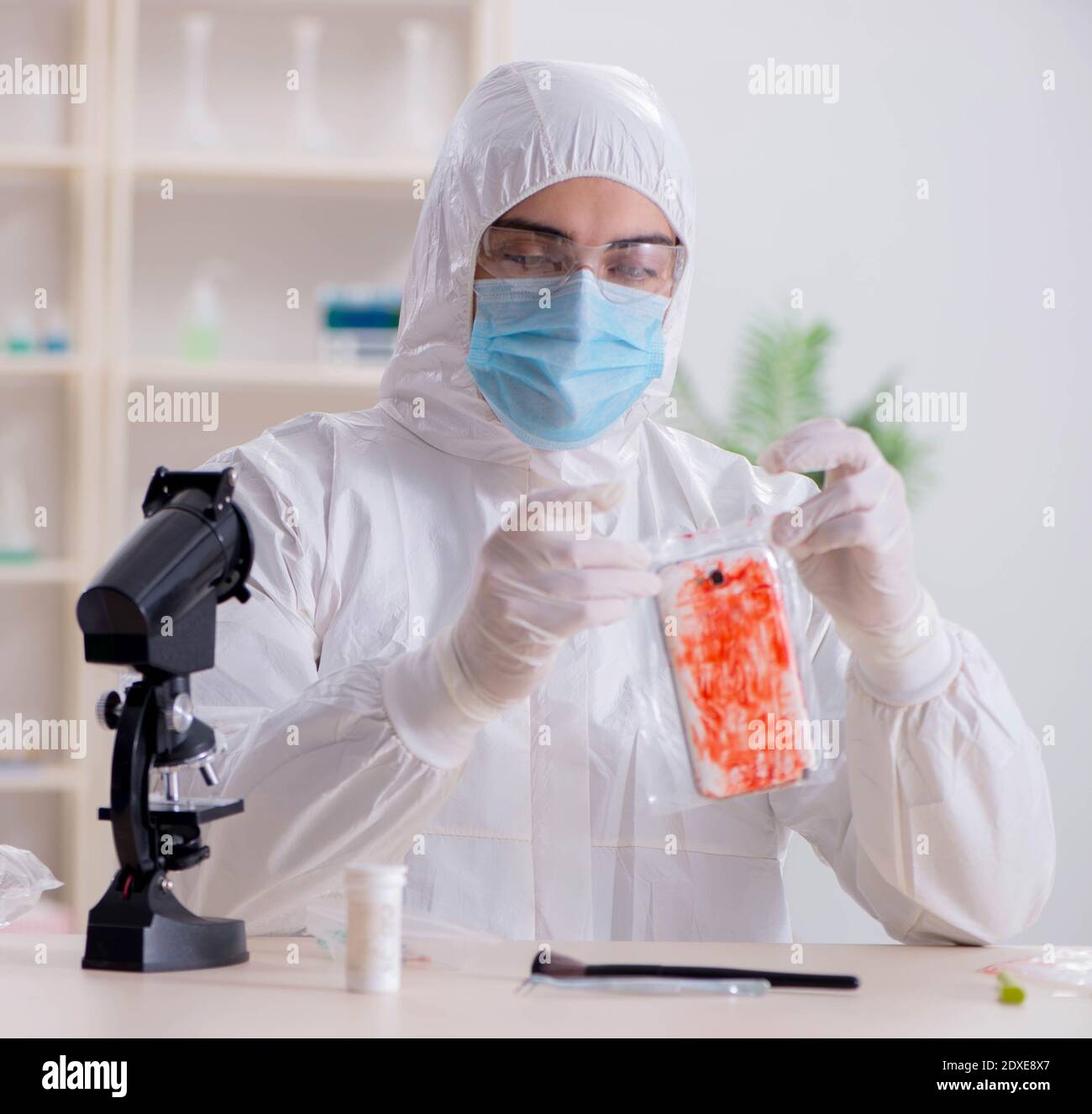 The expert criminologist working in the lab for evidence Stock Photo ...