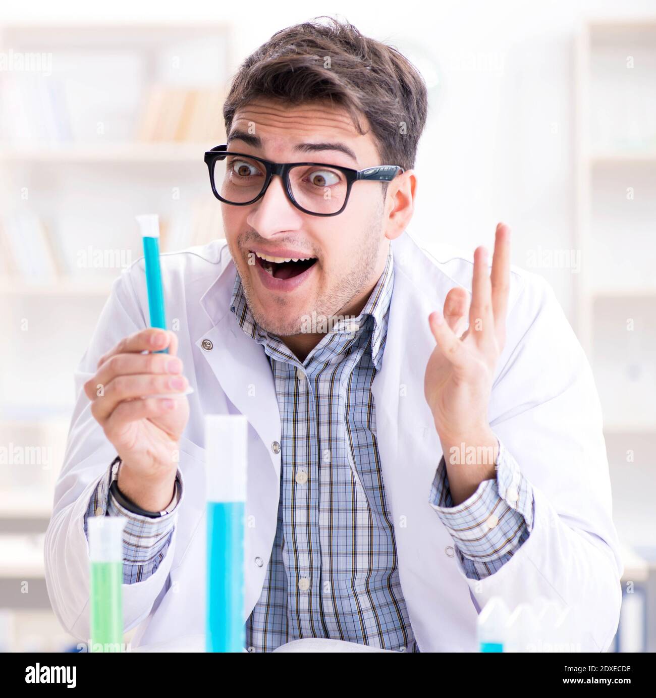 Chemistry student doing chemical experiments at classroom activity ...