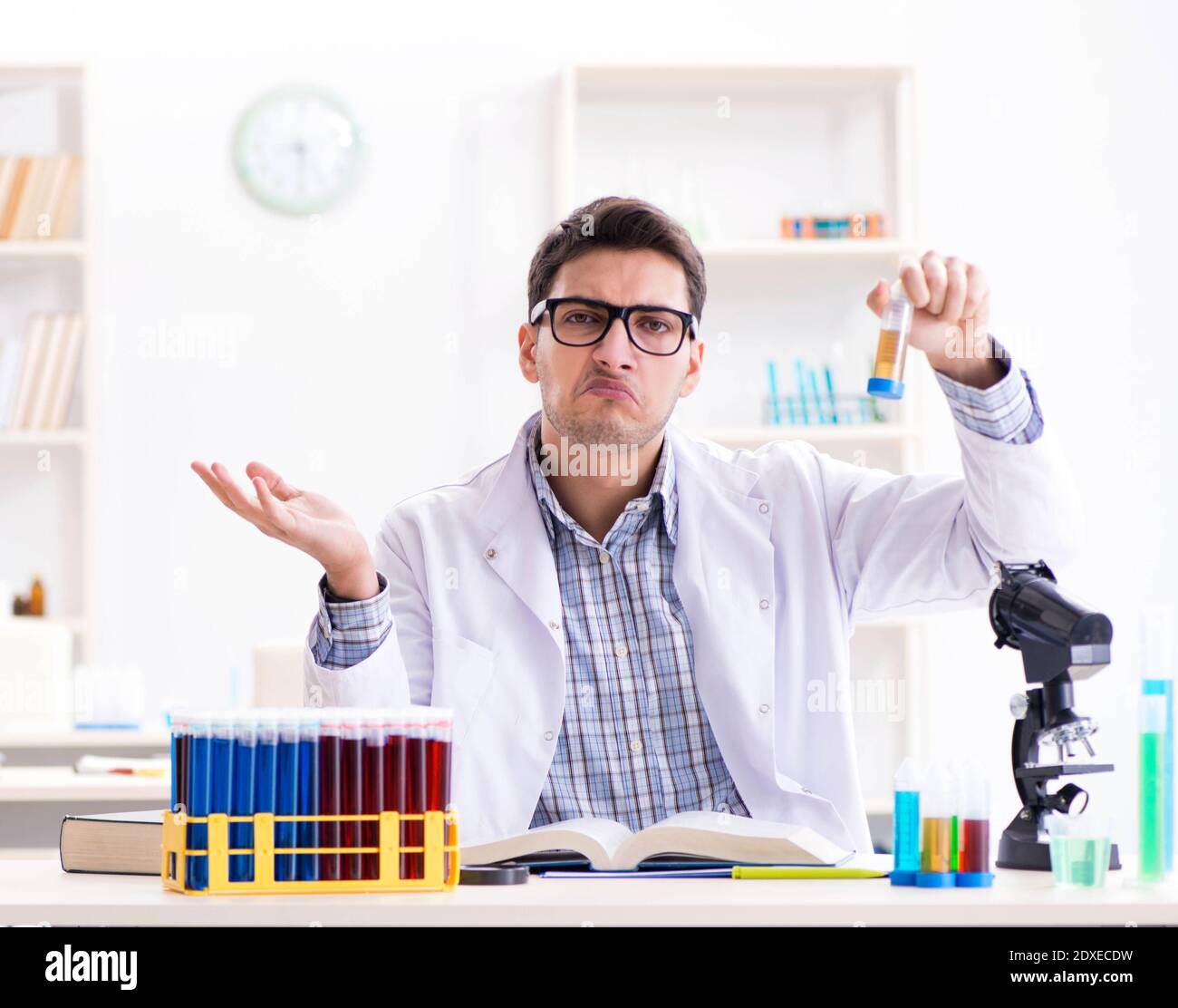 Chemistry student doing chemical experiments at classroom activity ...