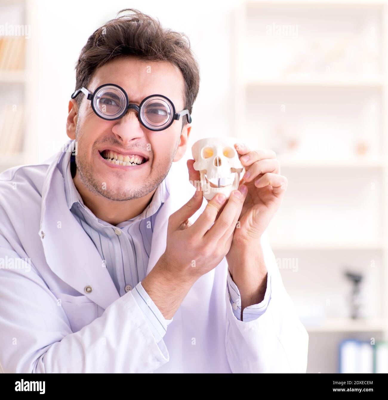 The crazy doctor studying human skeleton Stock Photo - Alamy