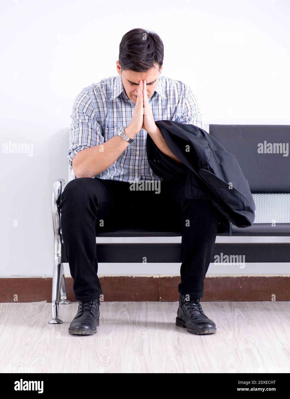 The man nervously impatiently waiting in the lobby Stock Photo - Alamy
