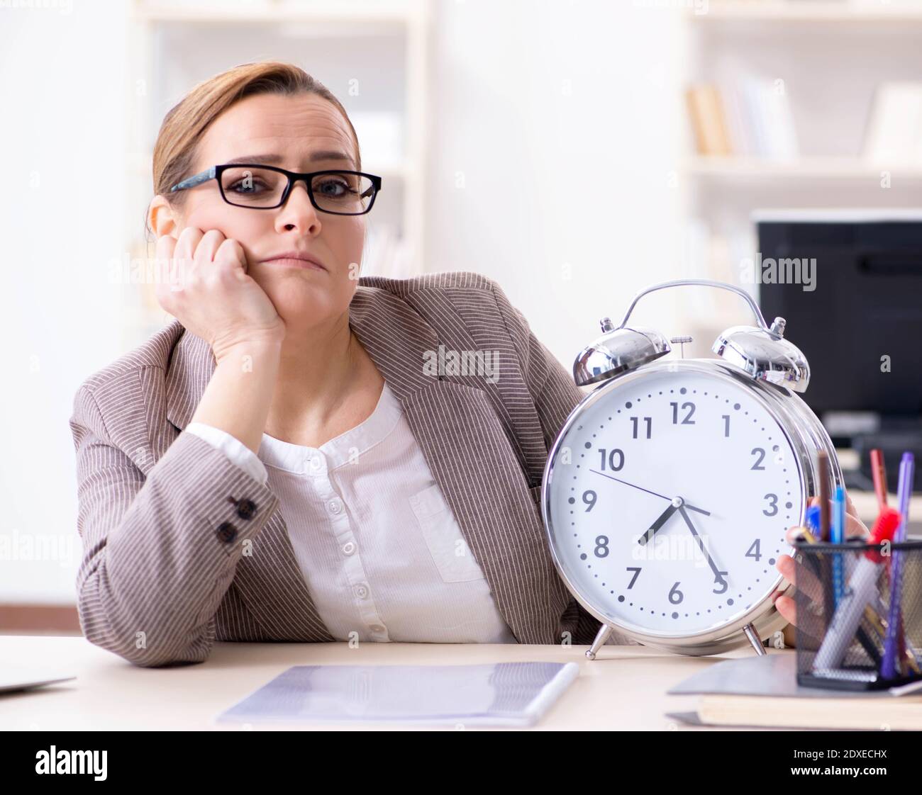 The businesswoman workaholic trying to finish urgent paperwork Stock ...