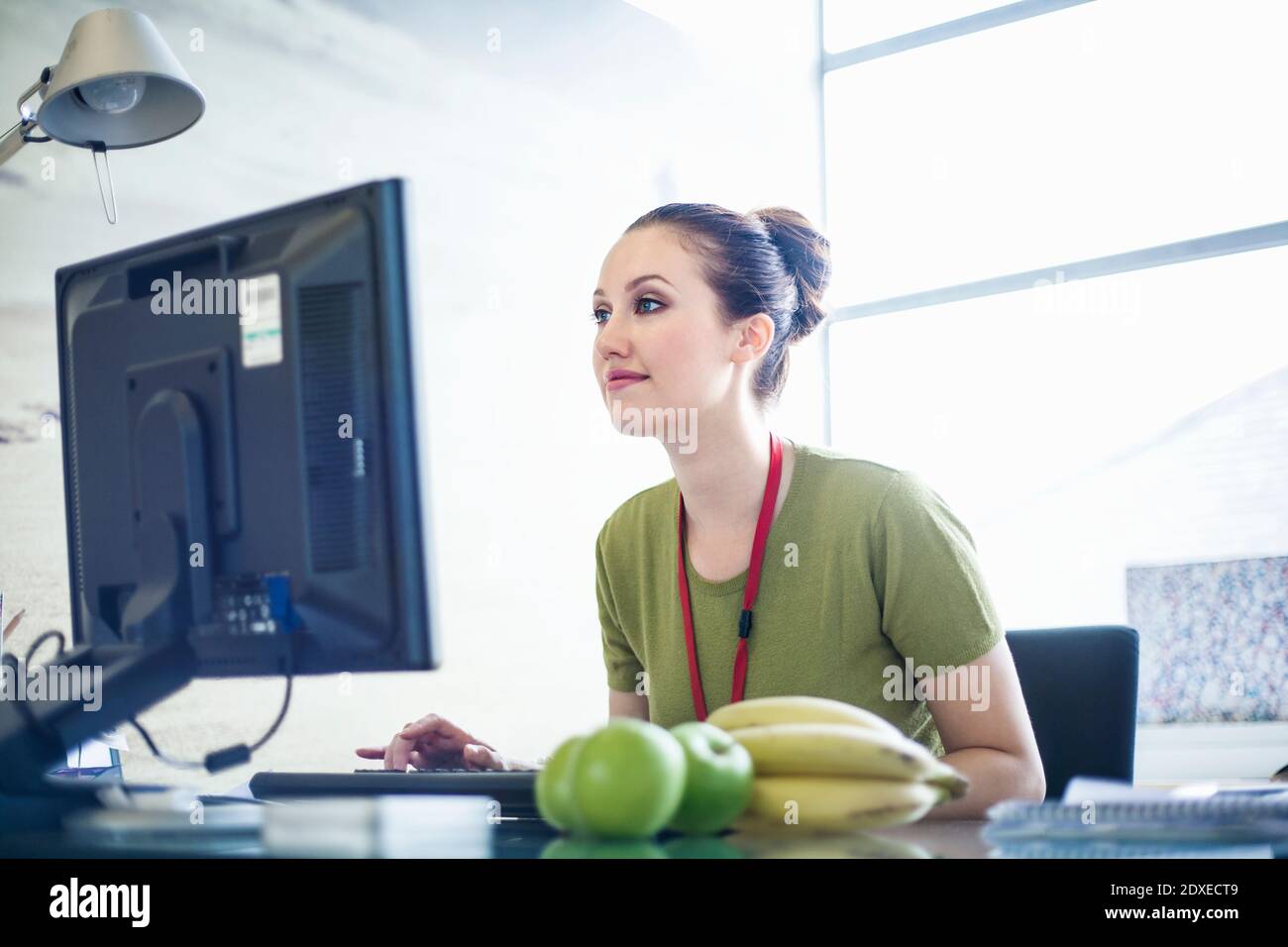 Female professional working on computer in board room at office Stock ...