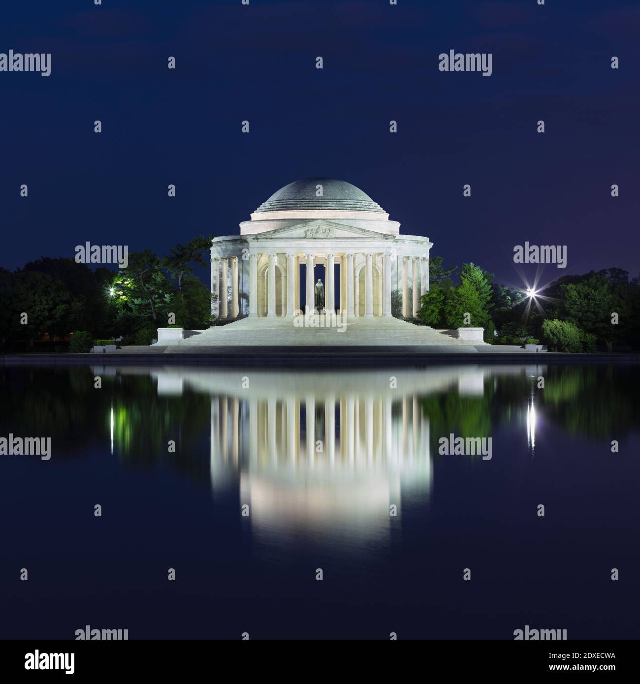 USA, Washington DC, Jefferson Memorial reflecting in Tidal Basin at ...