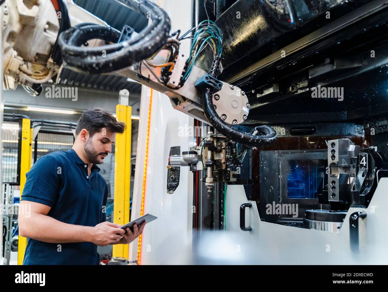 Young male worker using hi-res stock photography and images - Alamy