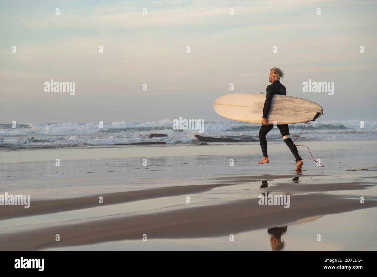 Man running from wave hi-res stock photography and images - Alamy