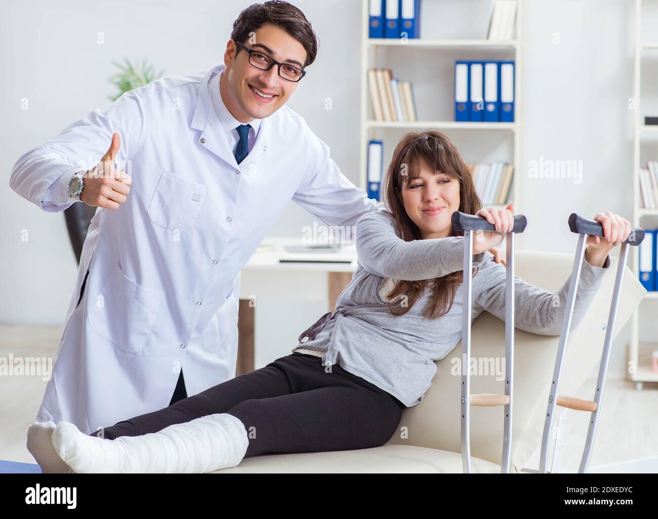 The doctor examining patient with broken leg Stock Photo - Alamy