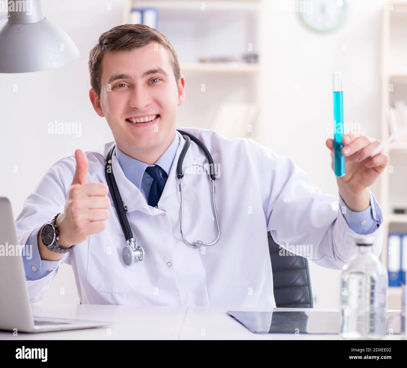 The male doctor looking at lab results in hospital Stock Photo - Alamy
