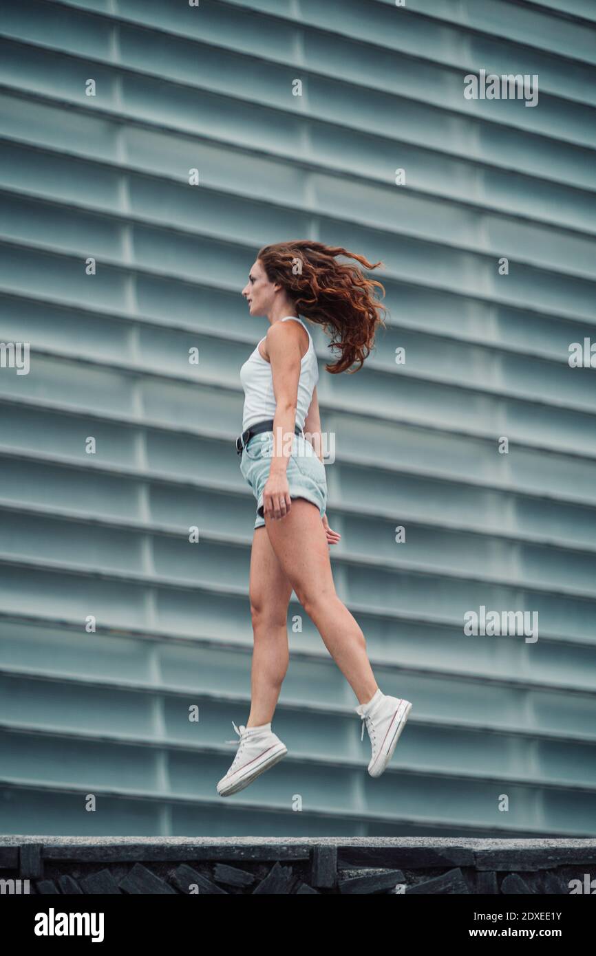 Side view woman walking against hi-res stock photography and images - Alamy
