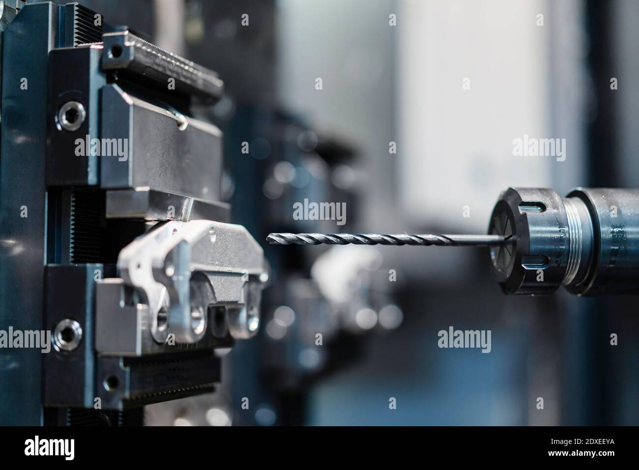 Drill press at industrial factory Stock Photo - Alamy