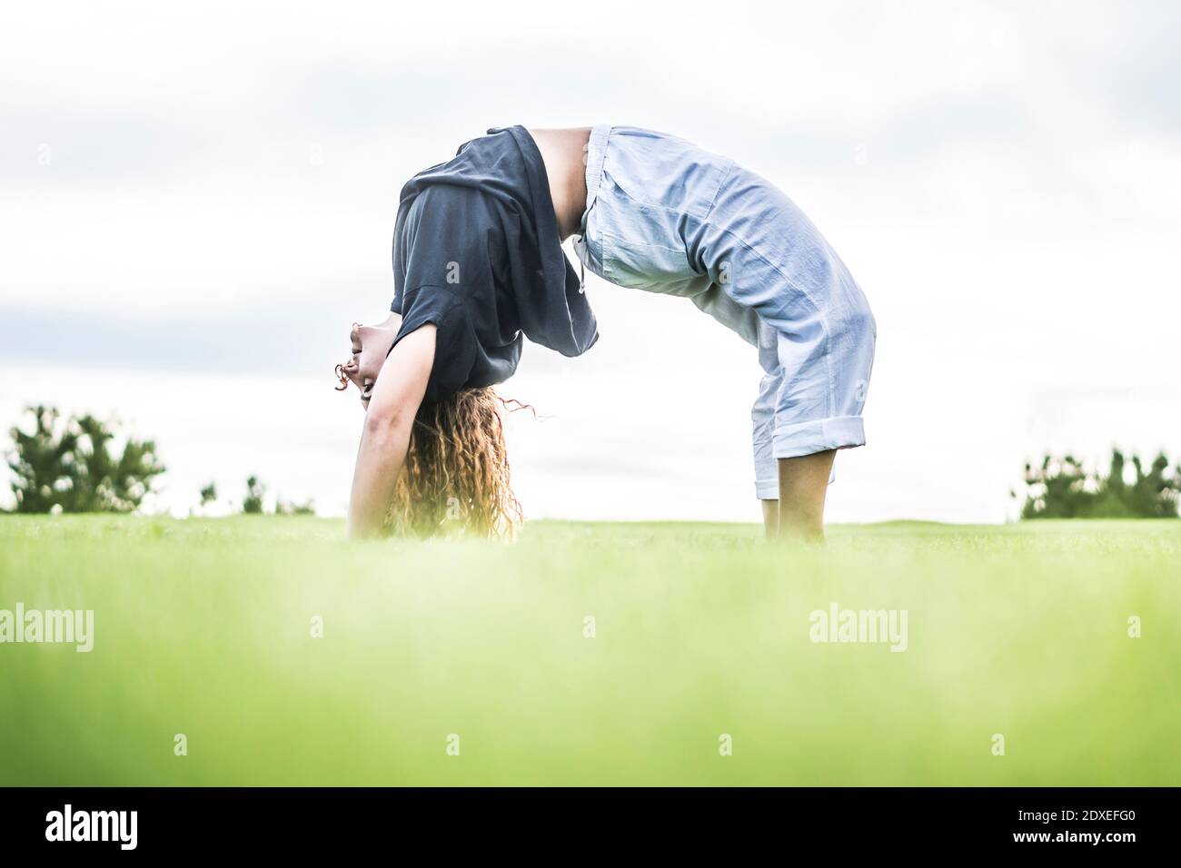 Female bending over hi-res stock photography and images - Alamy