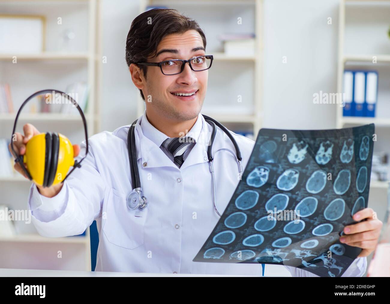 The safety doctor advising about noise cancelling headphones Stock ...