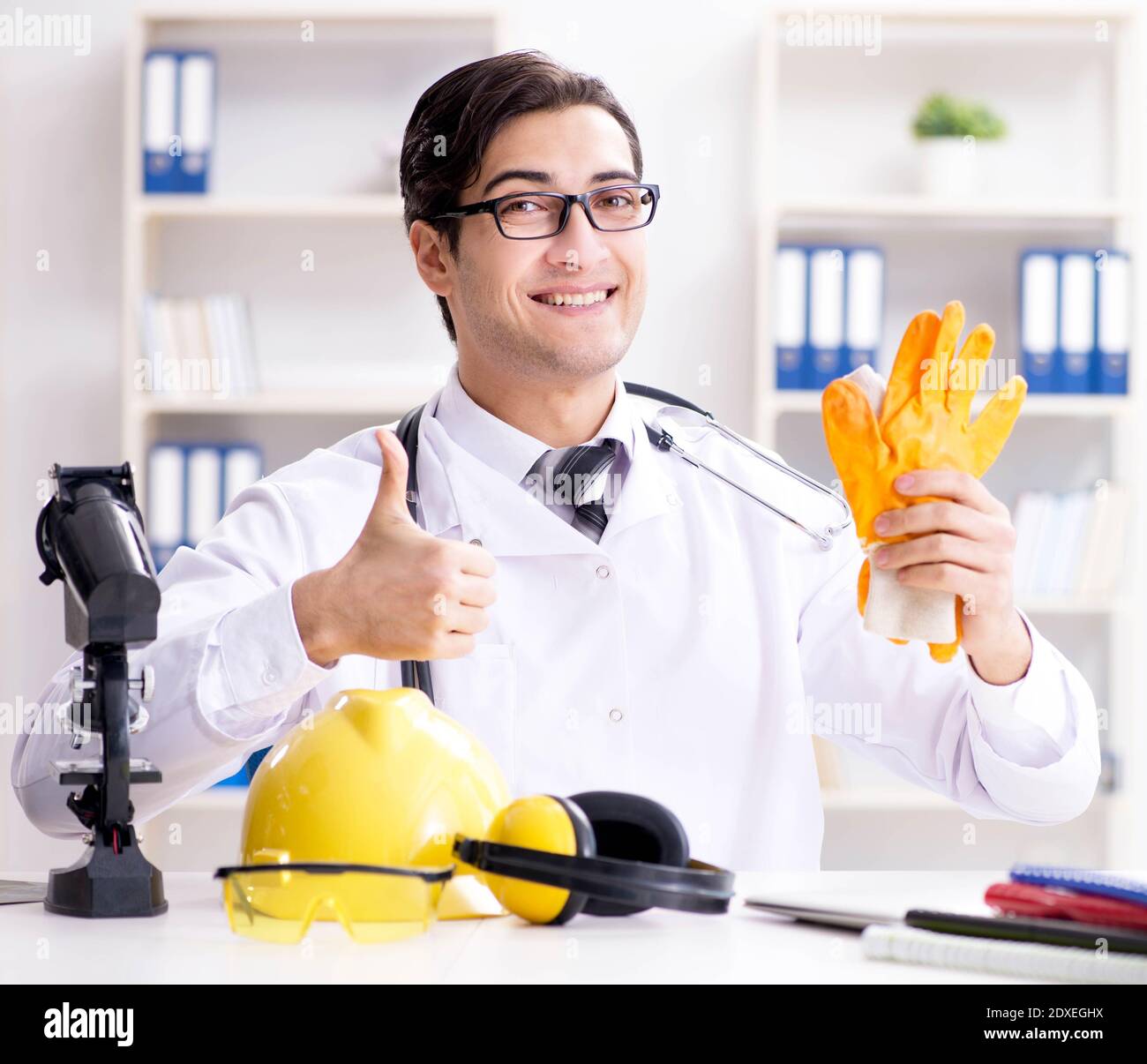 The safety doctor advising about wearing protective gloves Stock Photo ...
