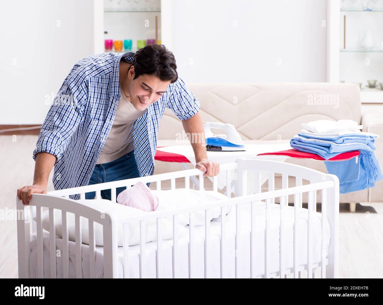 The young dad looking after newborn baby Stock Photo - Alamy